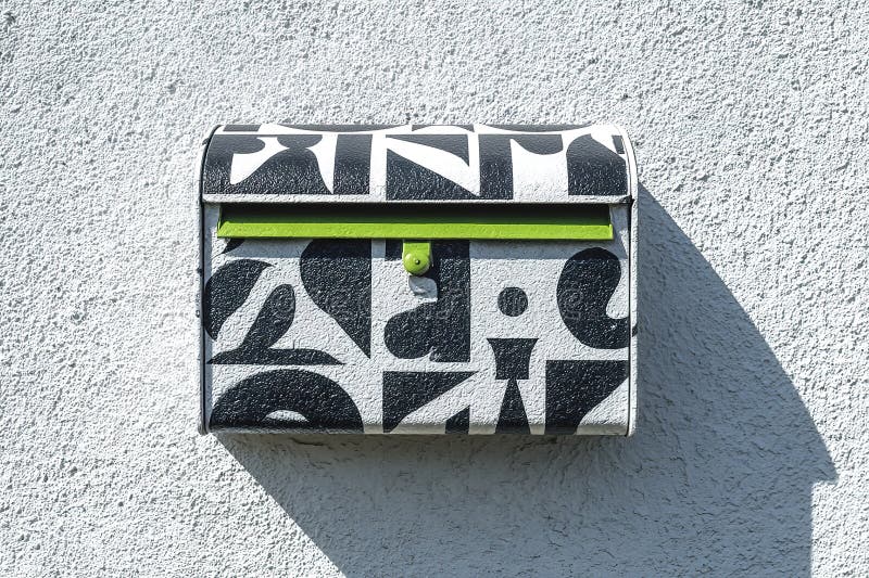 Colorful Mailbox Adorned with Bold Typography Displayed on a Textured ...