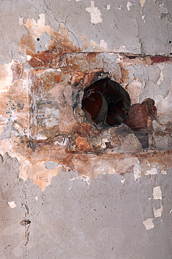 Coloful Patchwork in Wall Around a Pipe Stock Photo - Image of colorful ...