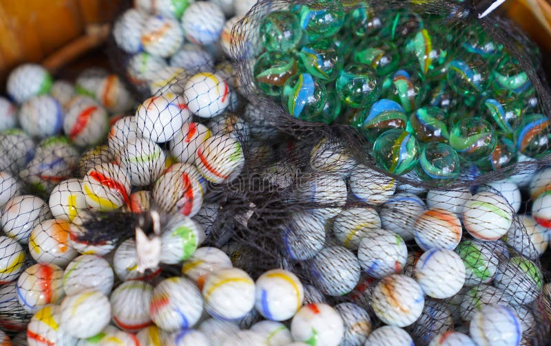 Colorful Marbles Stacked in a Net Stock Image - Image of stacked ...