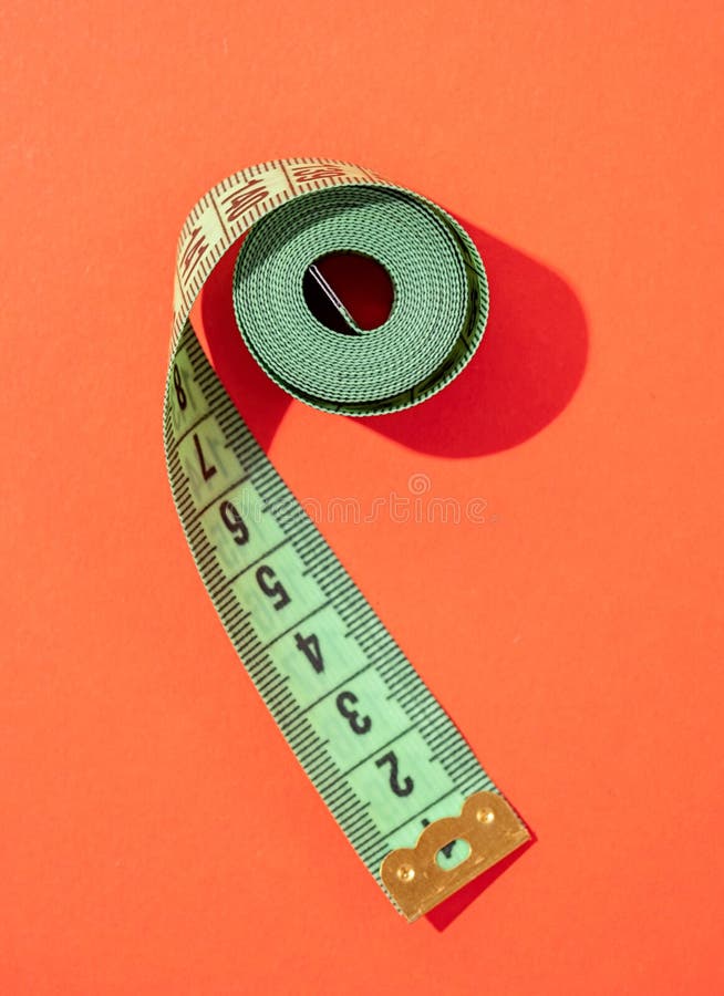 Colorful Measuring Tapes Top View on Bright Red Background Stock Photo ...