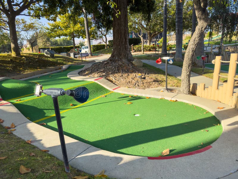 Mini-golf Course with Multiple Holes and Obstacles Surrounded by ...