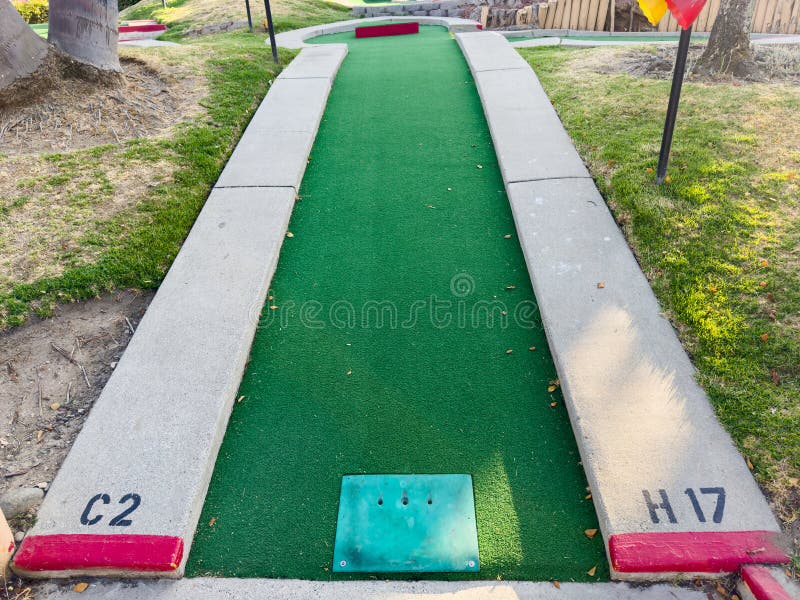 Mini-golf Course with Multiple Holes and Obstacles Surrounded by ...
