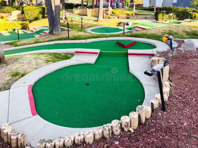 Mini-golf Course with Multiple Holes and Obstacles Surrounded by ...