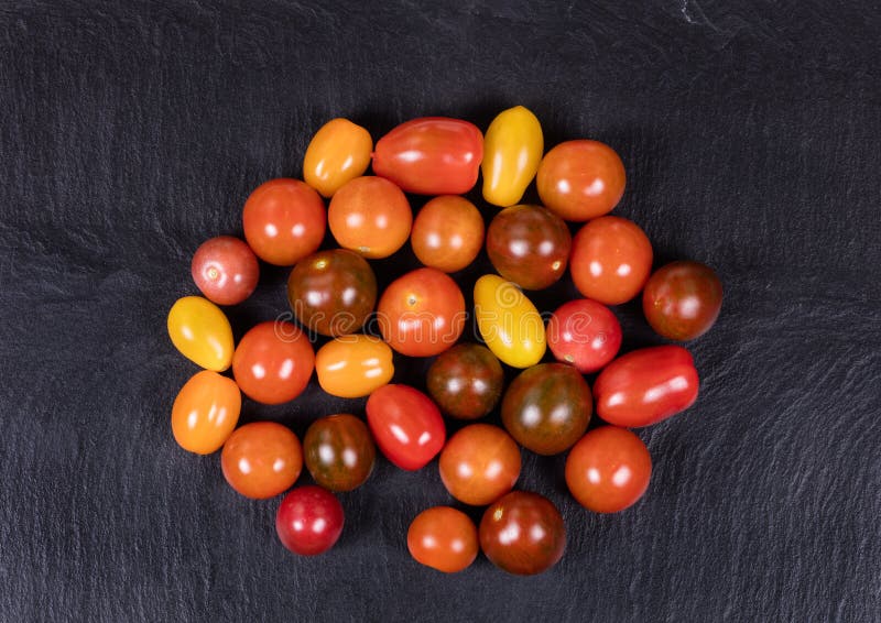 Colorful Mixed Small Tomatoes on Natural Black Slate Stone Stock Photo ...