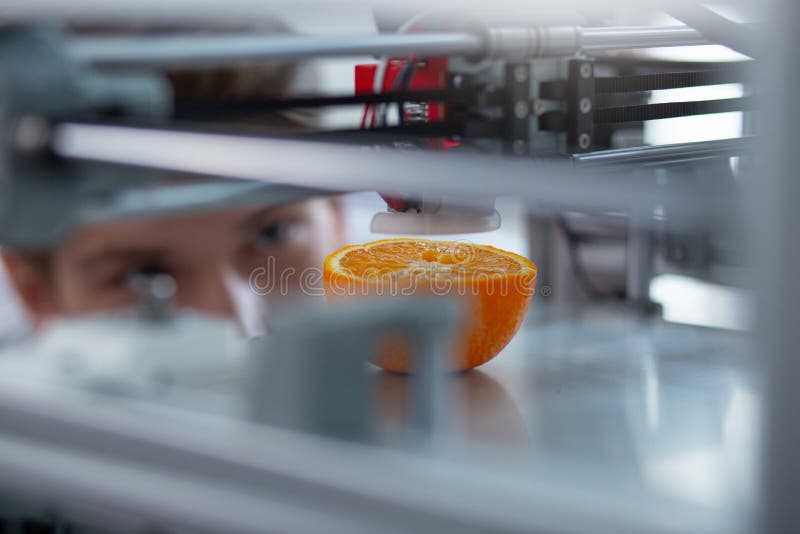 Colorful Model of Orange Being Created by 3D Printer Stock Photo ...