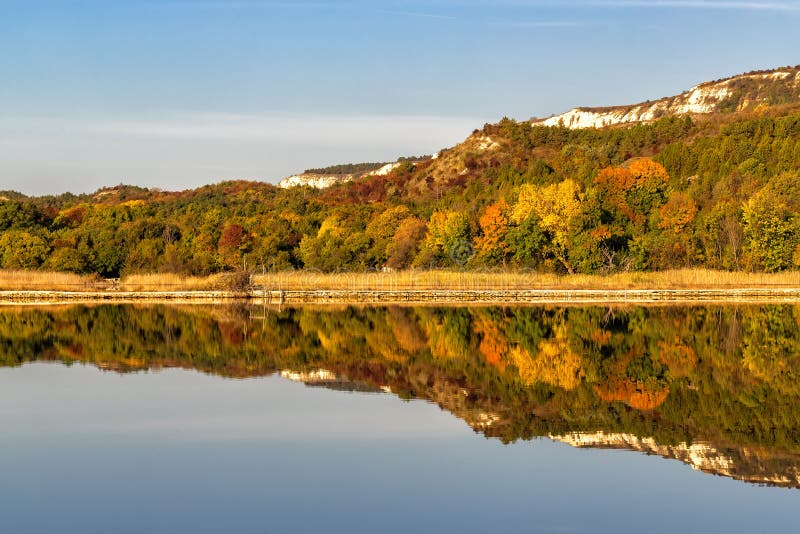 Colorful Mountain Reflection on a Calm Lake at Sunrise Stock Photo ...