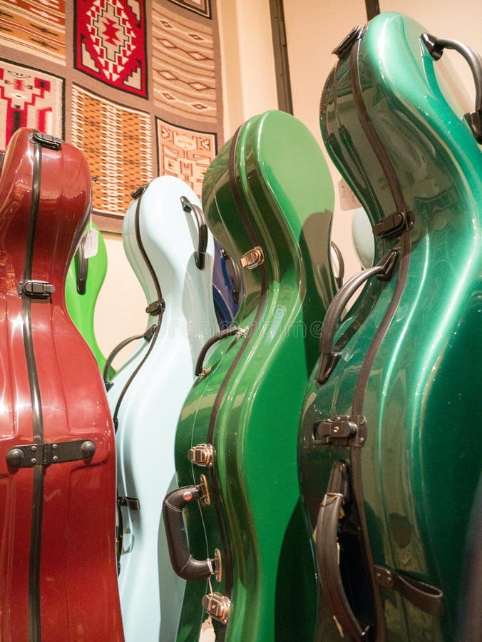 Colorful Multicolor Cello Carrying Cases Standing on Display Stock ...