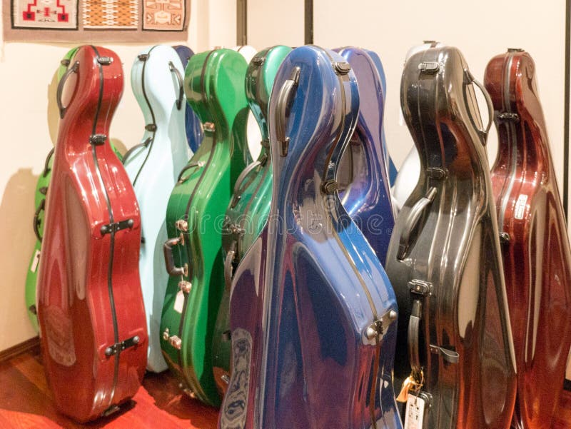 Colorful Multicolor Cello Carrying Cases Standing on Display Stock ...
