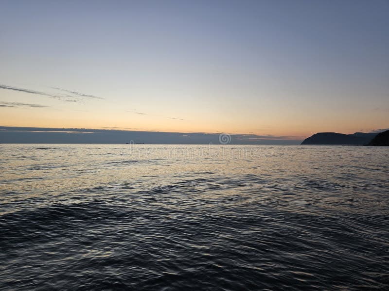 Colorful Ocean Beach Sunrise with Deep Blue Sky and Sun. Stock Image ...