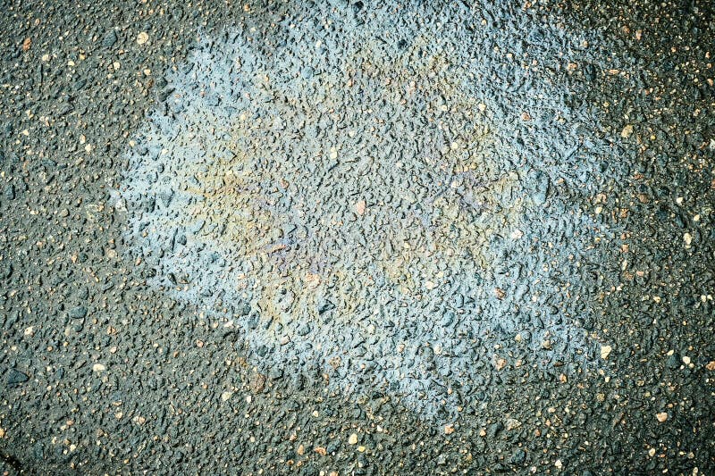 Colorful Oil Stain on Asphalt Road Surface Showcasing Textures and ...