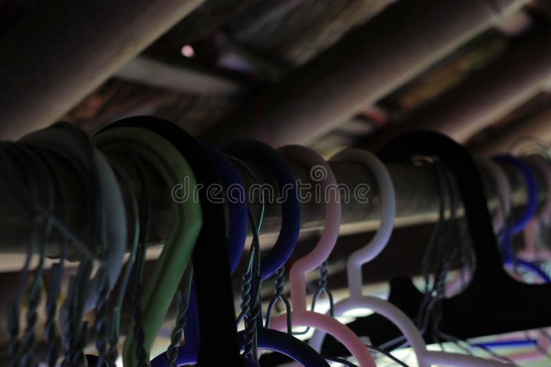 Colorful Old Used Hanger Hanging on a Bamboo Stick Stock Photo - Image ...