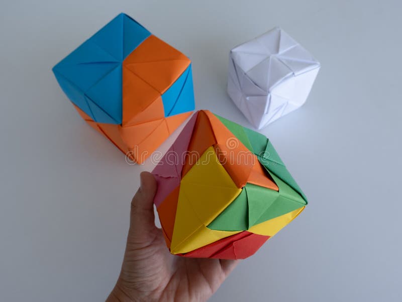 Colorful Origami Cubes on White Table Stock Photo - Image of mood ...