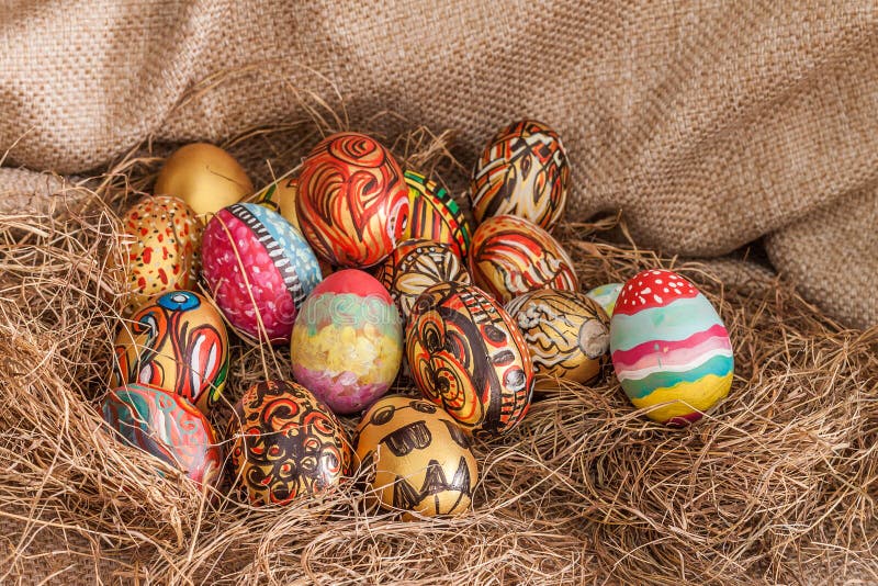 Colorful Painted Easter Egg on Hay Stock Photo - Image of stack, shiny ...