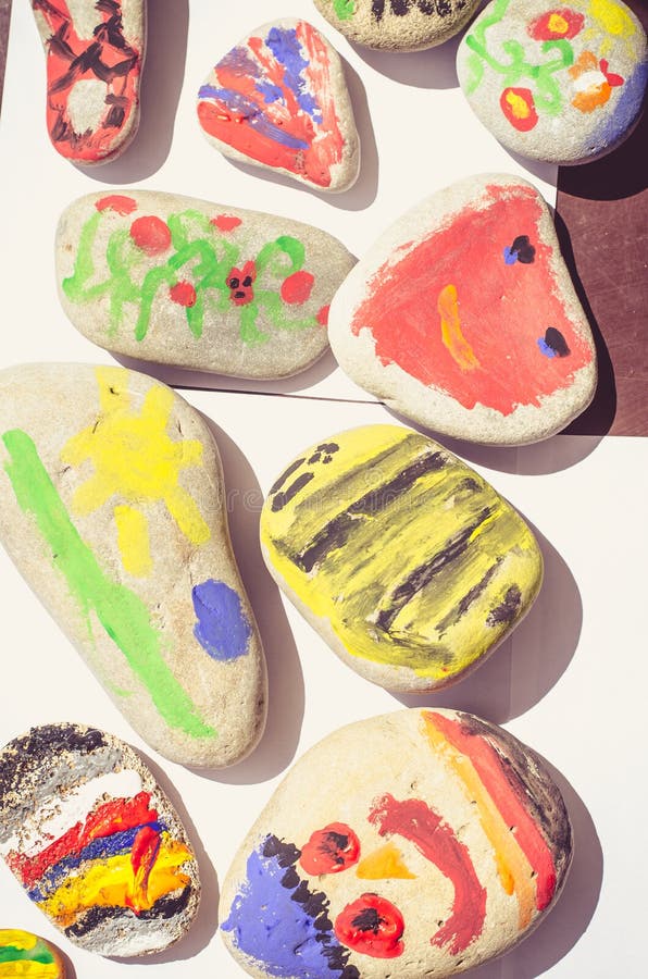 Colorful painted pebbles stock image. Image of shape - 118730943
