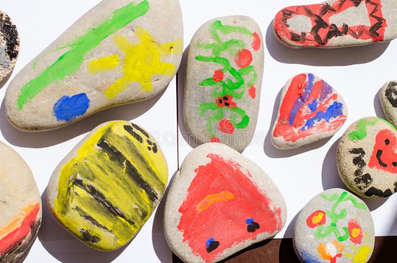 Colorful painted pebbles stock image. Image of yellow - 118733809