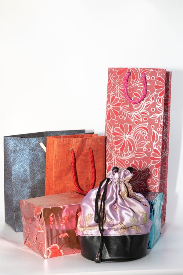 Colorful Paper Carry Bags and a Silk Cloth Pouch Stock Photo - Image of ...