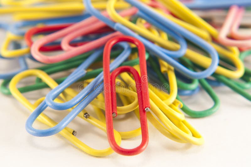 Colorful Paper Clip and Ordinary Clips on White Background. Stock ...