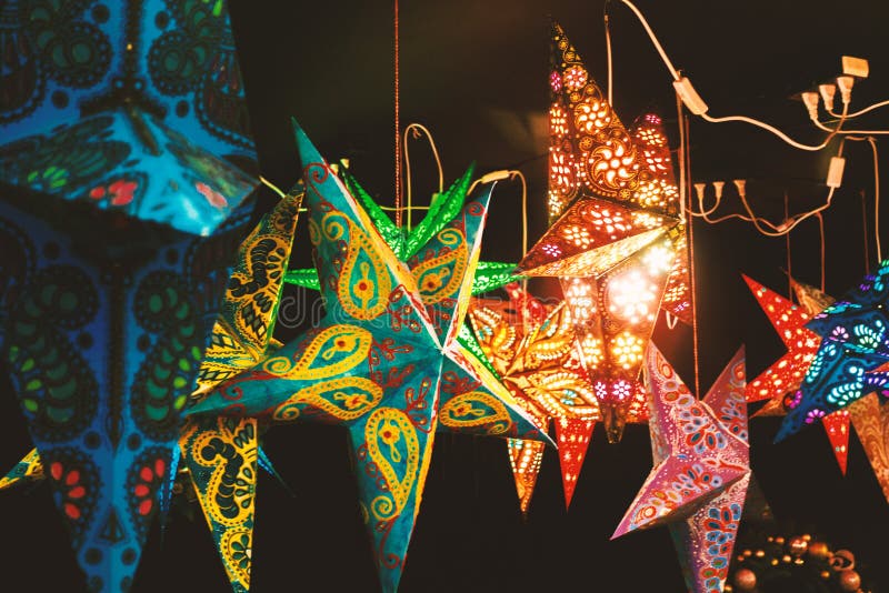 Colorful Paper Glowing Stars Hanging on the Ropes Stock Image - Image ...