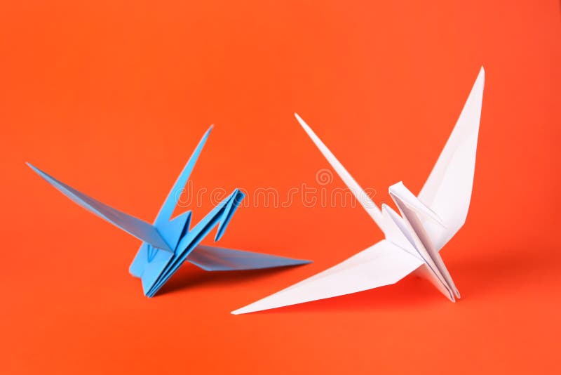 Colorful Paper Origami Cranes on Orange Background Stock Photo - Image ...