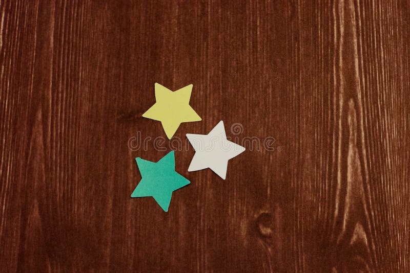 Colorful Paper Stars Over Wood Texture Stock Image - Image of ...