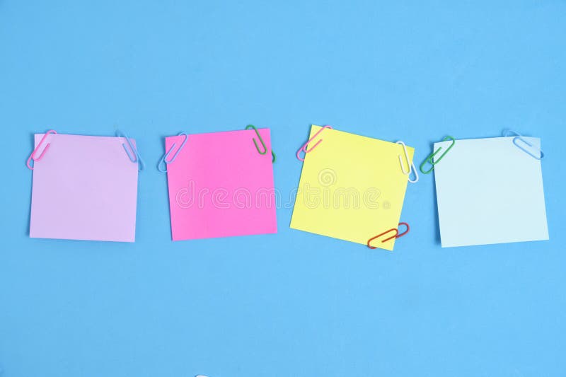 Colorful Paper Stickers for Writing Notes on a Blue Background. Stock ...