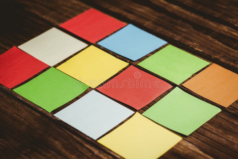 Colorful Papers on Wooden Surface Stock Photo - Image of arrangement ...