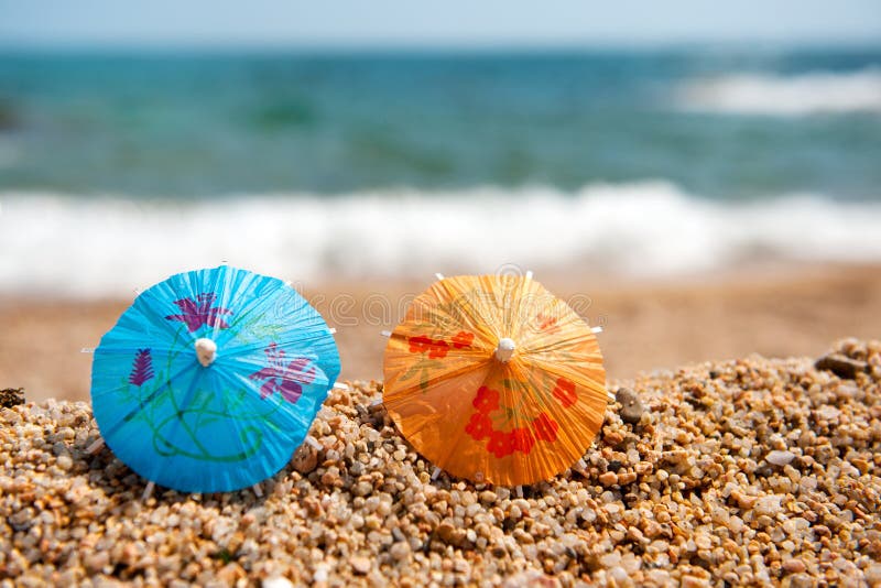 Colorful Parasols in the Grass Stock Image - Image of green, traveling ...