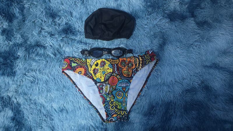 Colorful Patterned Bikini with Matching Swim Cap and Sunglasses on Soft ...