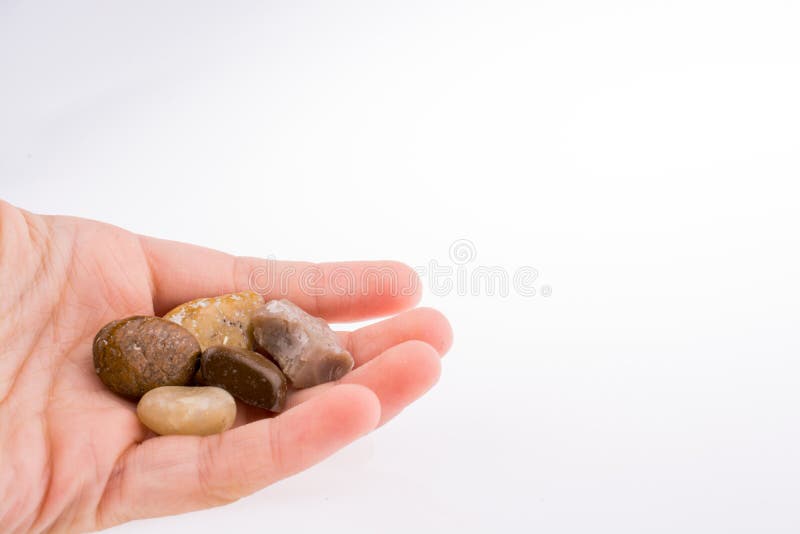 Colorful pebbles in hand stock image. Image of pebbles - 74958081