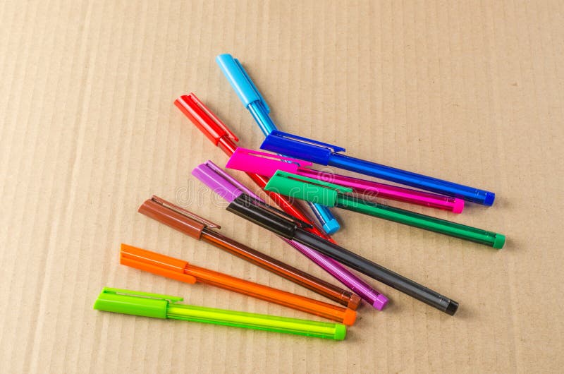 Colorful pen on cardboard stock photo. Image of heap - 95721262