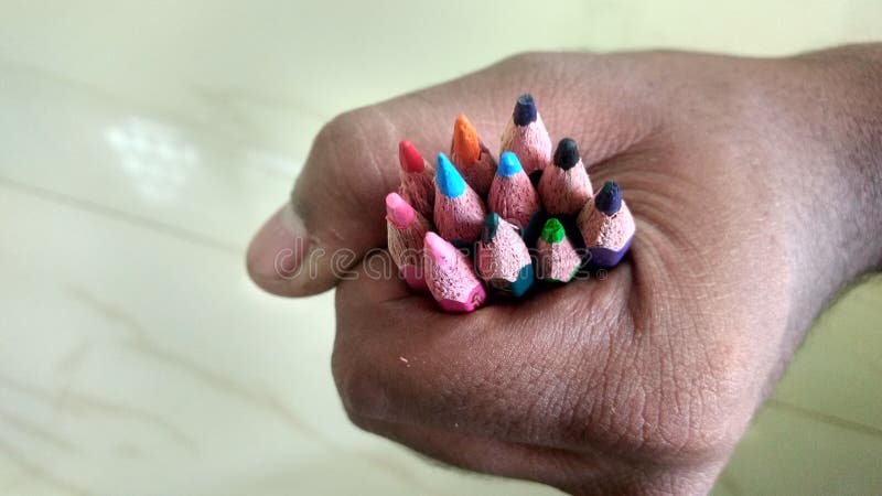 Colorful pencils in hand editorial image. Image of hand - 92332435