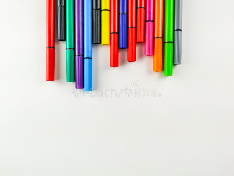 Colorful Pens with Caps on White Background on Upper Side of the Image ...