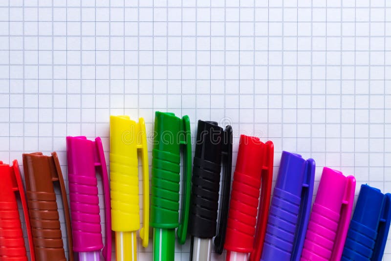 Colorful Pens in a Row on Sheet of Squared Paper Stock Photo - Image of ...