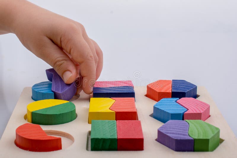 Colorful Pieces of a Logic Puzzle in Hand Stock Image - Image of blocks ...