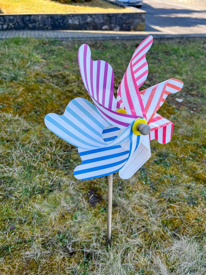 Colorful Pinwheel with Houses in the Background Stock Photo - Image of ...