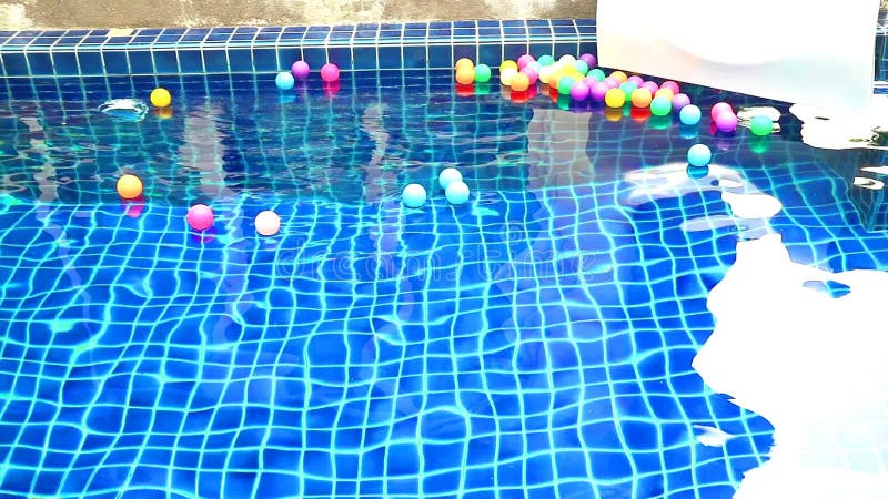 Colorful Plastic Ball Floating on Water Surface of Swimming Pool Stock ...