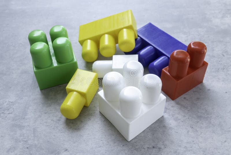 Colorful Plastic Building Blocks on Gray Surface Stock Image - Image of ...