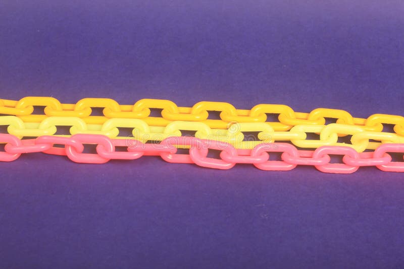 Colorful Plastic Chains on a Blue Background Stock Photo - Image of ...