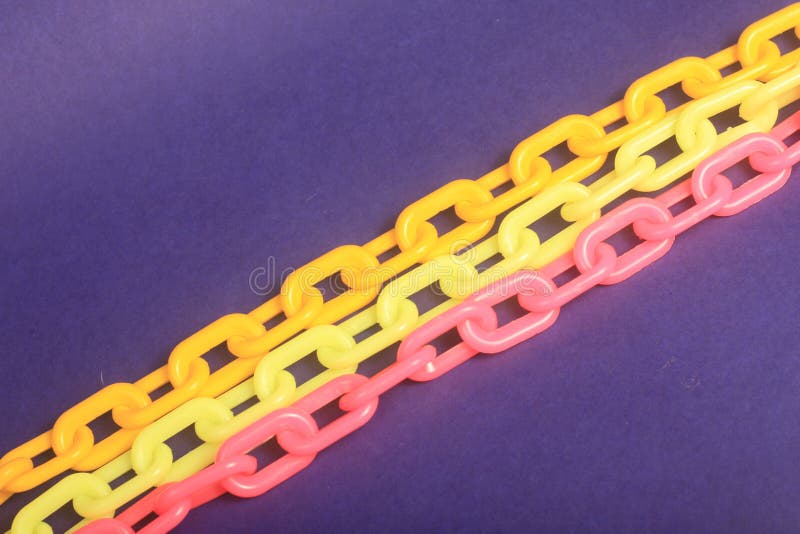 Colorful Plastic Chains on a Blue Background Stock Image - Image of ...
