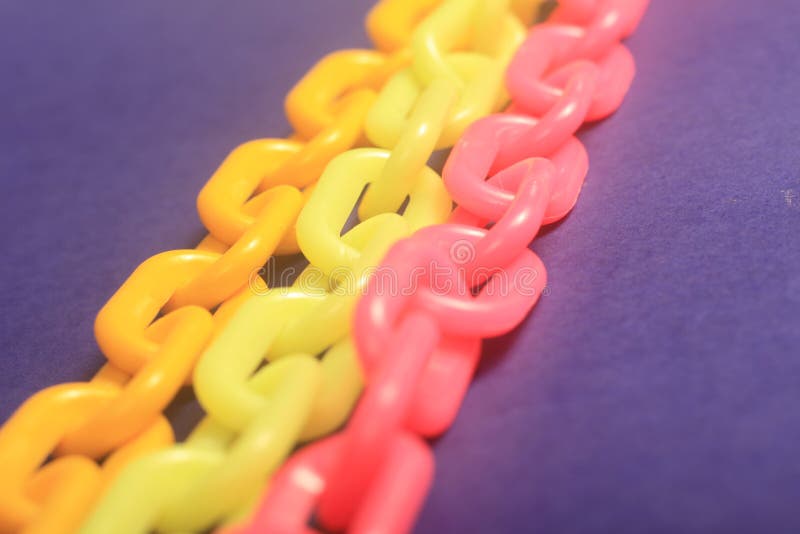 Colorful Plastic Chains on a Blue Background Stock Photo - Image of ...
