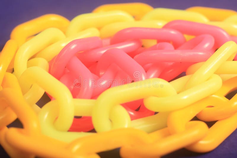 Colorful Plastic Chains on a Blue Background Stock Photo - Image of ...