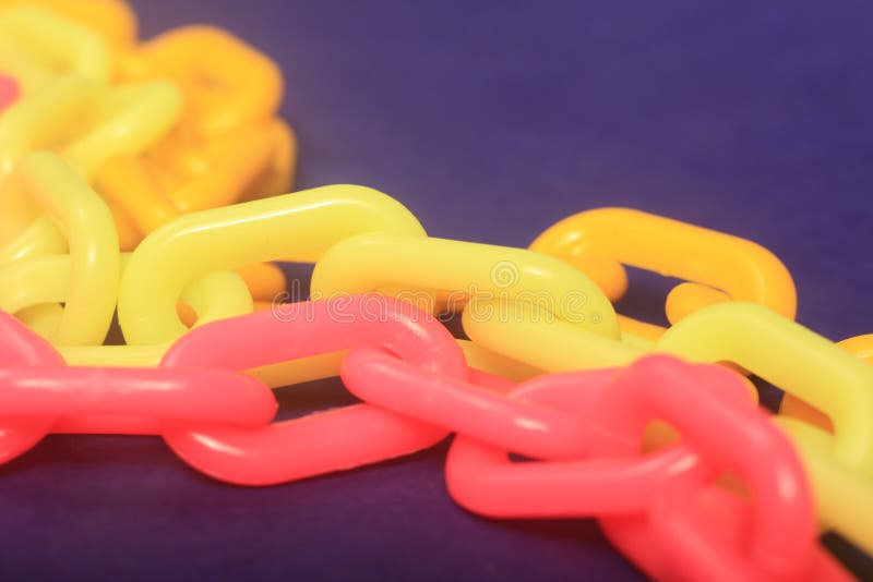 Colorful Plastic Chains on a Blue Background Stock Image - Image of ...