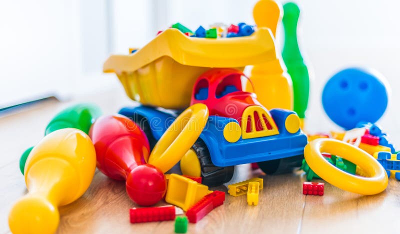 Colorful Plastic Children Toys on the Floor Stock Photo - Image of ...