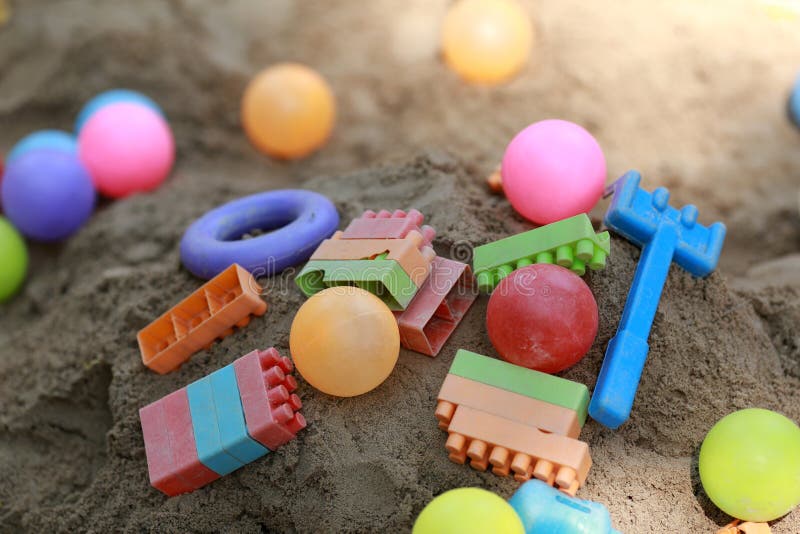 Colorful Plastic Children Toys in Sand Pit Stock Photo - Image of ...