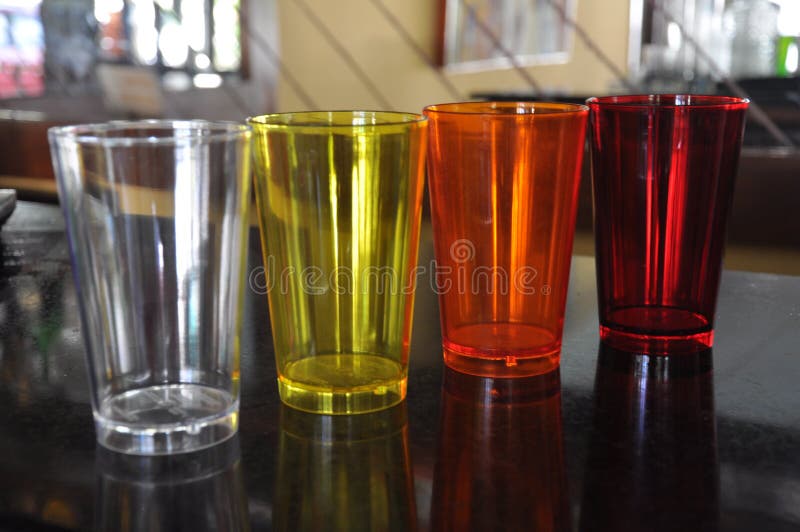 Colorful Plastic Cups on a Bar Stock Photo - Image of reflects, yellow ...