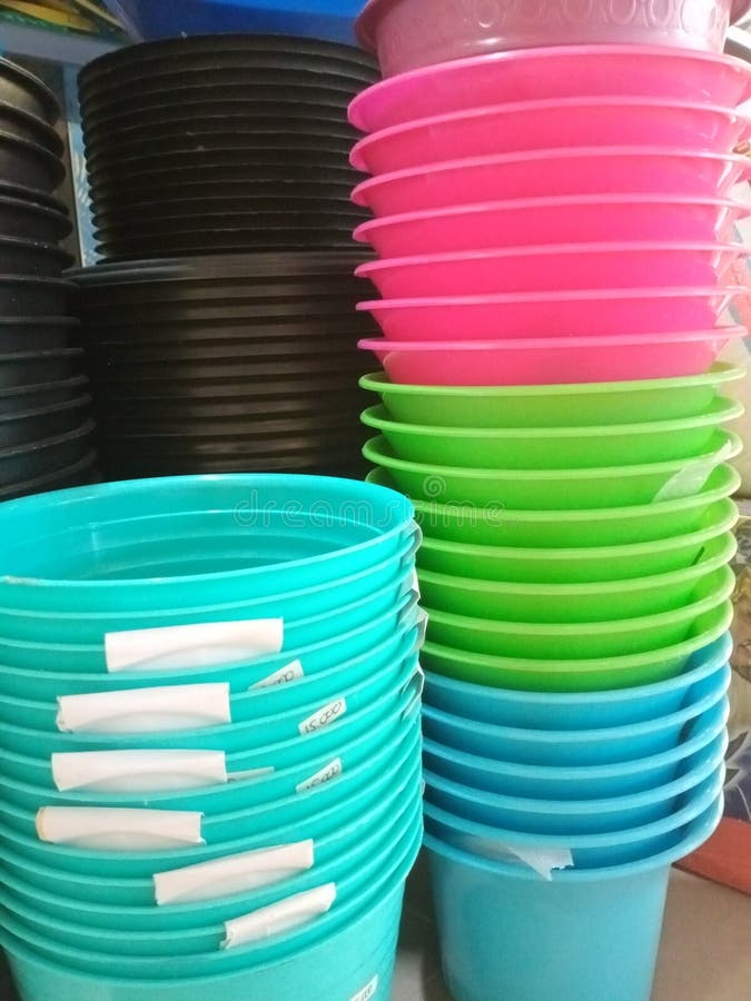 Colorful Plastic Flower Pots Stock Photo - Image of wheel, glass: 219684748