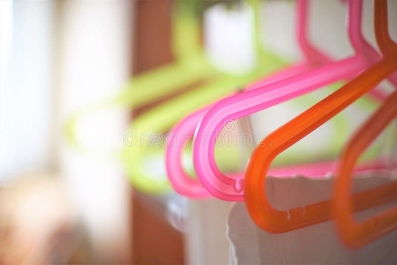 Colorful Plastic Hangers Hanging on the Rack Stock Photo - Image of ...