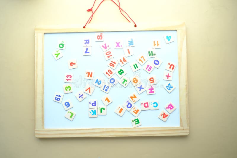 Colorful Plastic Letters on White Board on Table Stock Image - Image of ...