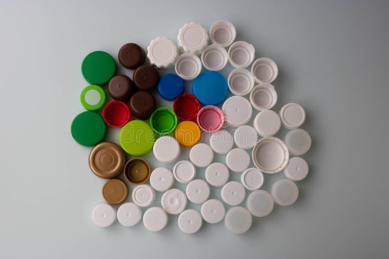 Colorful Plastic Lids from Different Drinks are on the Table Stock ...