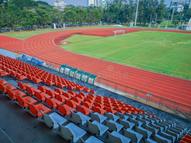 Colorful Plastic Seats at the Stadium. Stock Image - Image of colorful ...